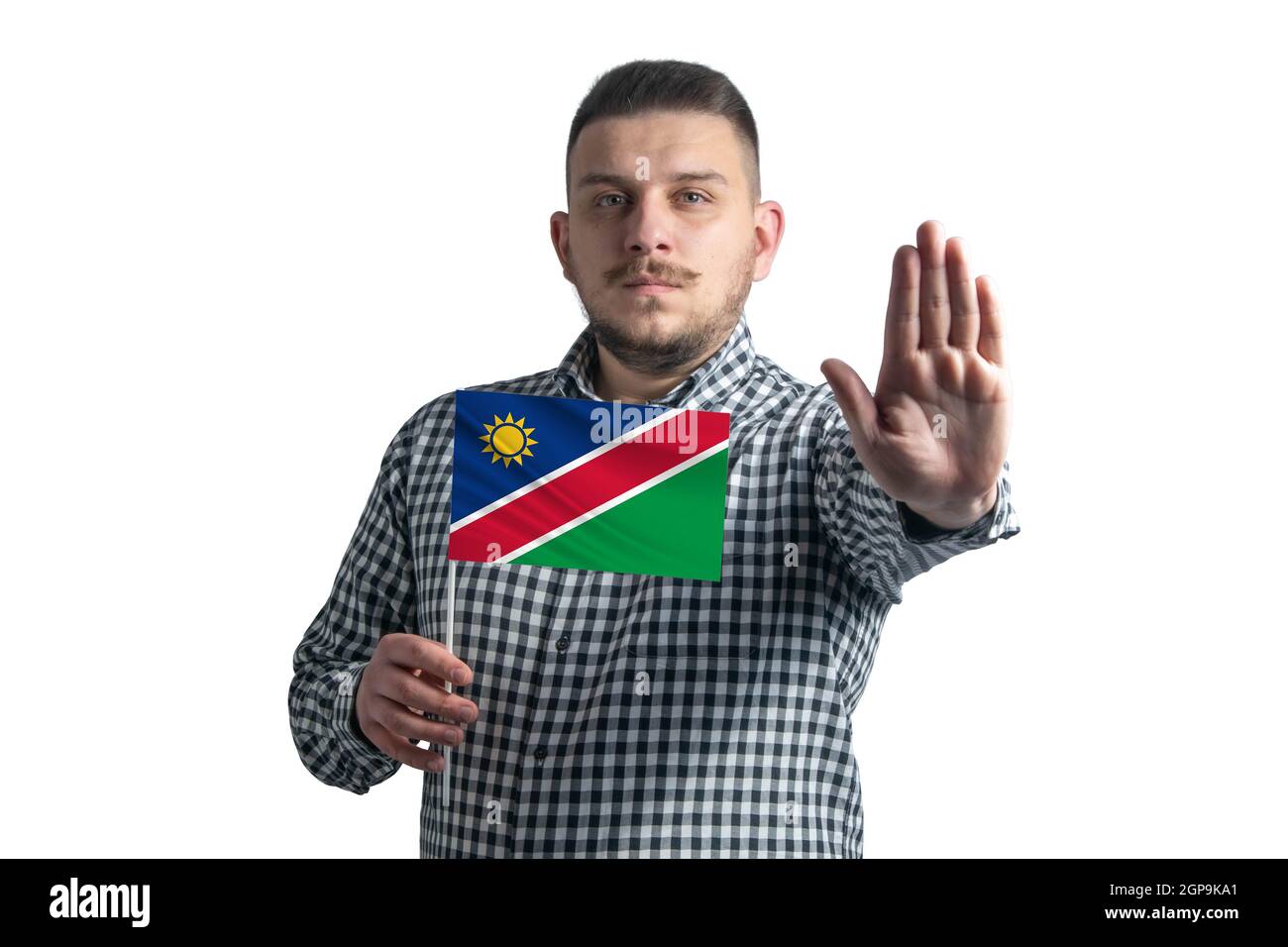 White guy holding a flag of Namibia and with a serious face shows a ...
