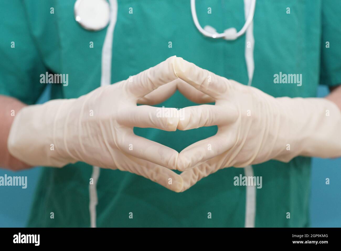 Surgeon explains surgical method doctor in op clothes and rubber gloves ...