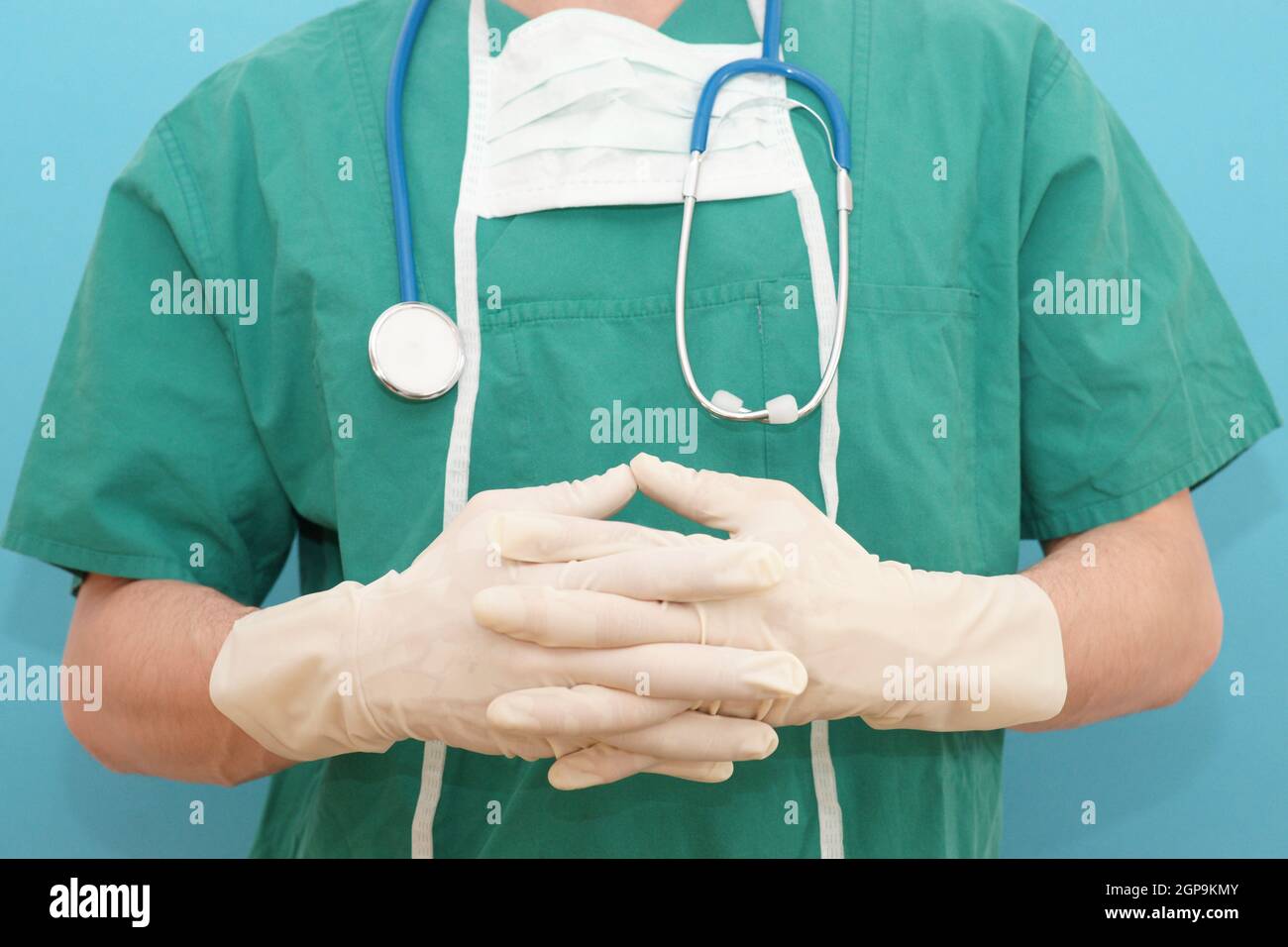 Surgeon explains surgical method doctor in op clothes and rubber gloves ...