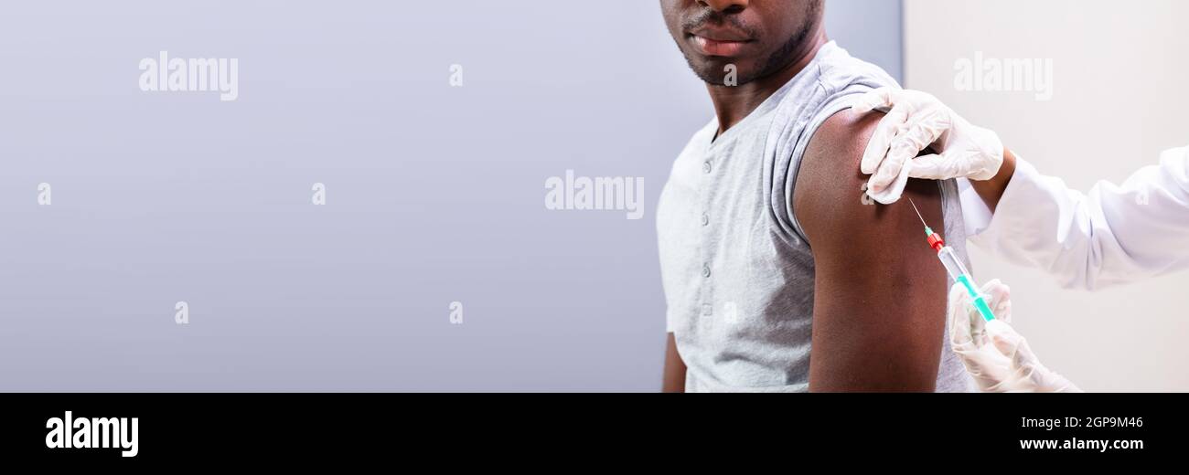 Doctor Making Covid 19 Vaccine Injection In Arm Stock Photo - Alamy