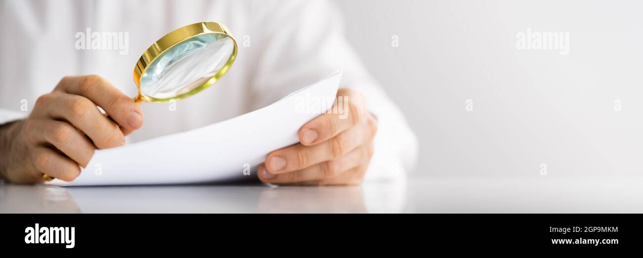 Fraud Investigation Through Magnifying Glass. Businessman Holding Loupe ...