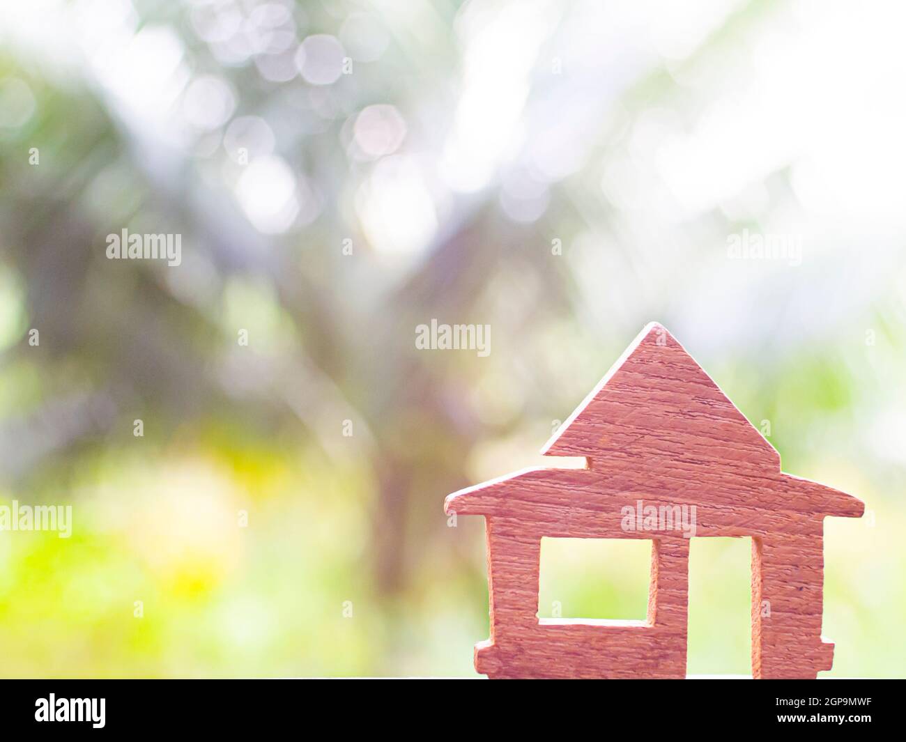House model. Affordable housing concepts. Wooden House Model on wooden ...