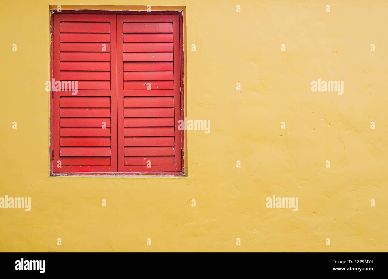 Red shutter louver window on Mediterranean Italian Stucco wall ...