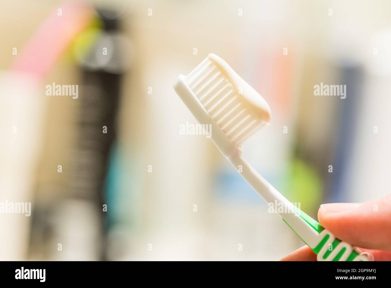 Colorful toothbrush in the bathroom, morning routine Stock Photo - Alamy