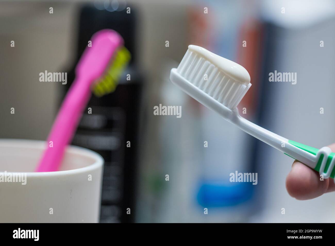 Colorful toothbrush in the bathroom, morning routine Stock Photo - Alamy