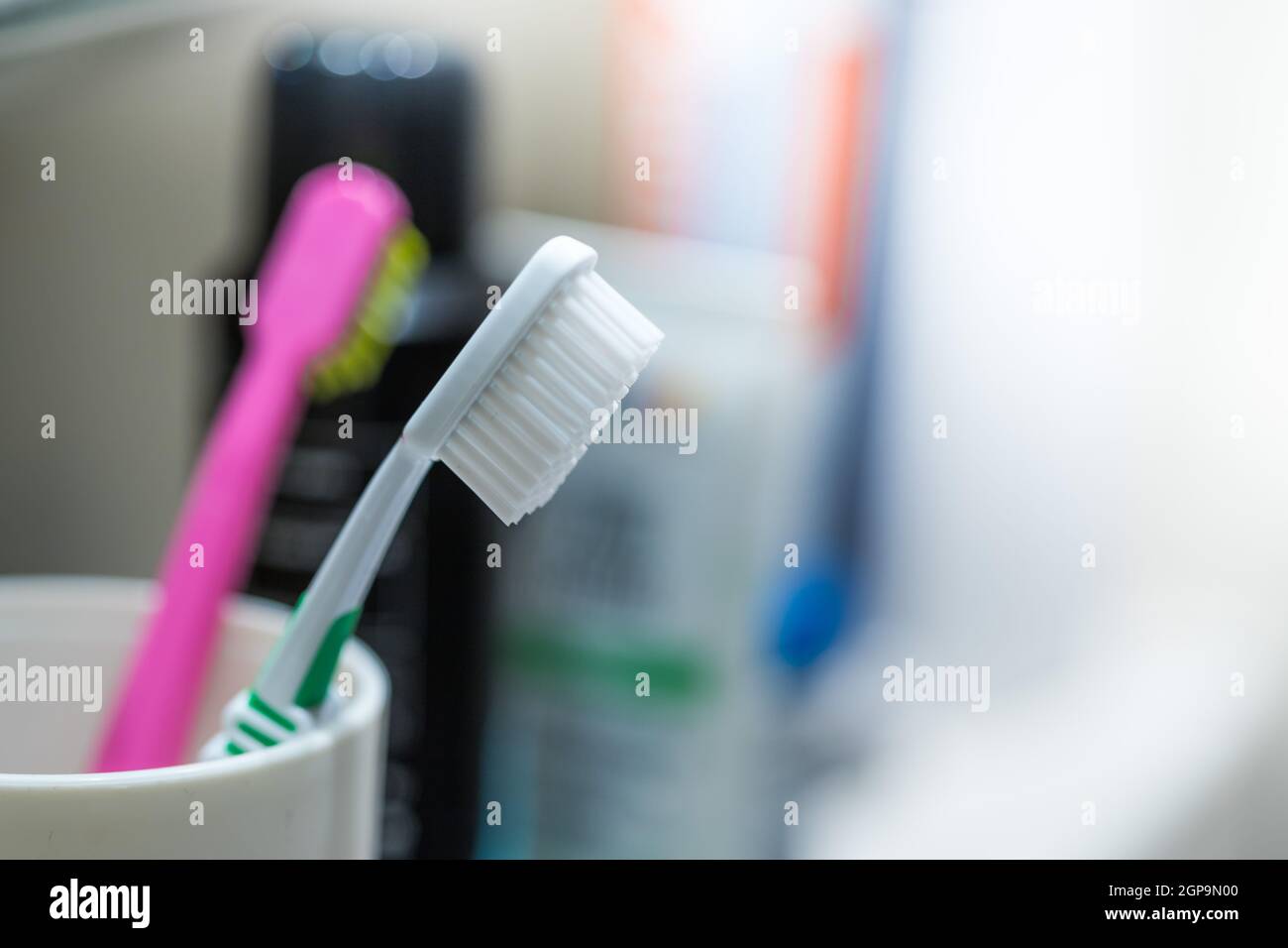 Colorful toothbrush in the bathroom, morning routine Stock Photo - Alamy