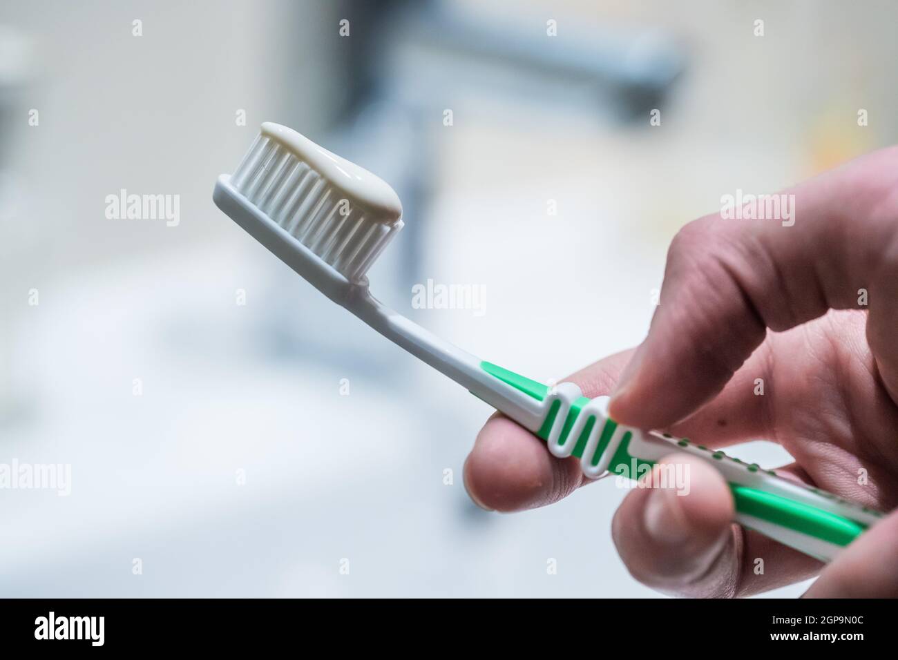 Colorful toothbrush in the bathroom, morning routine Stock Photo - Alamy