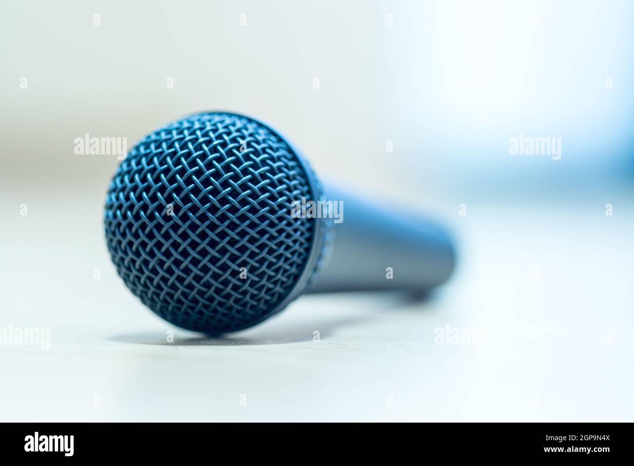 Black microphone stands on the desk. Interview, copy space Stock Photo ...