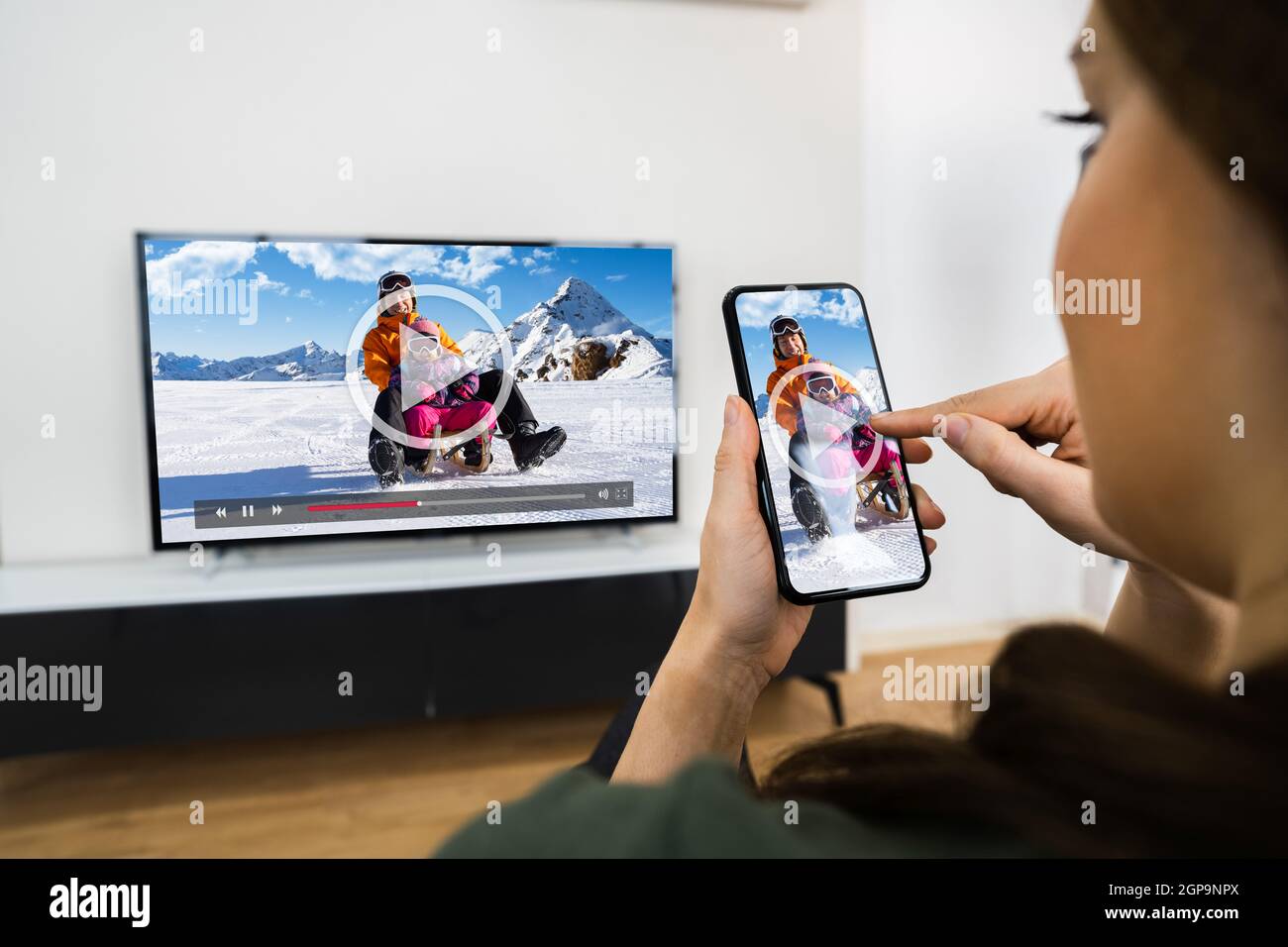 Woman Watching TV Streaming From Smartphone Or Mobile Phone Stock Photo ...