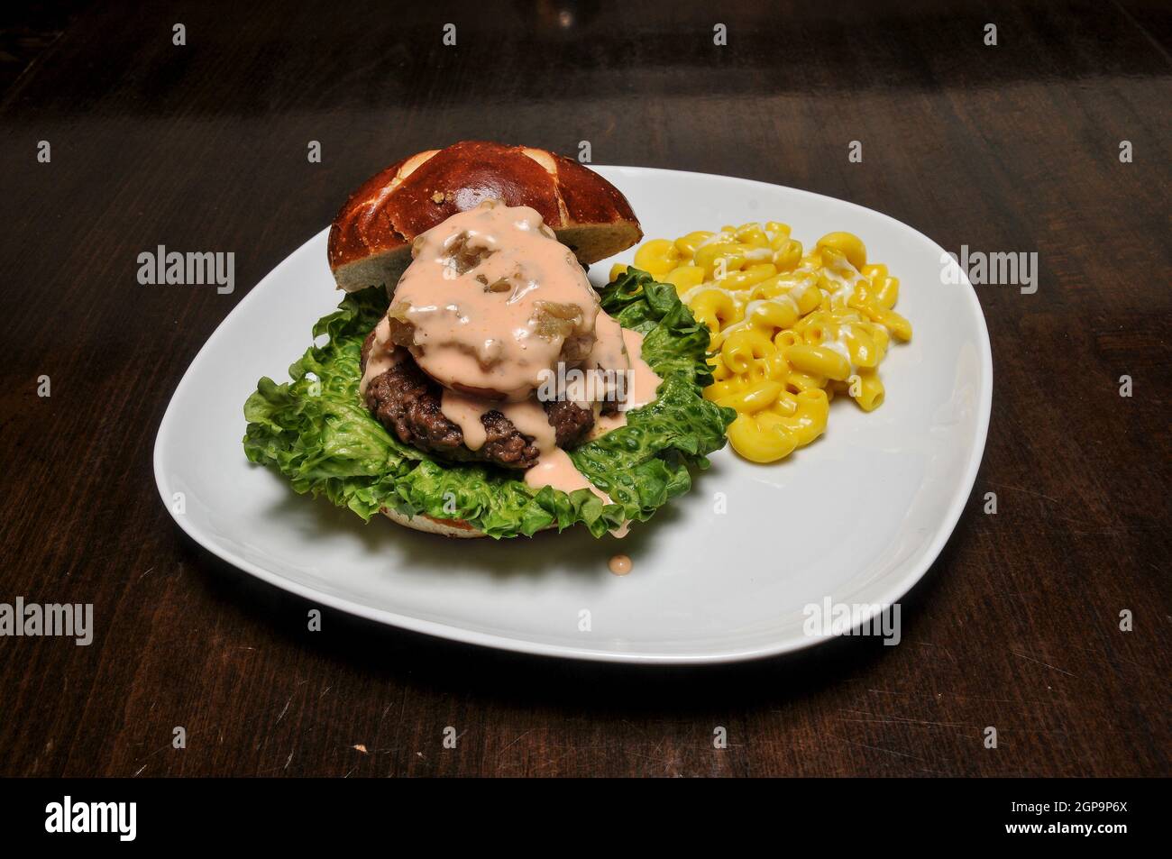 Delicious cheeseburger with all the fixings on a bun Stock Photo - Alamy