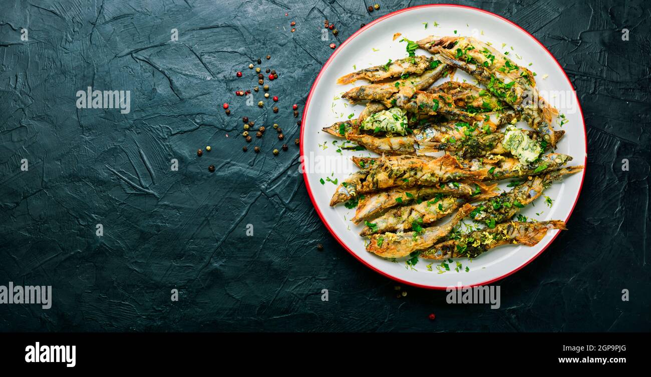 Fried capelin fish with herbs and lemon zest.Fish dish Stock Photo - Alamy