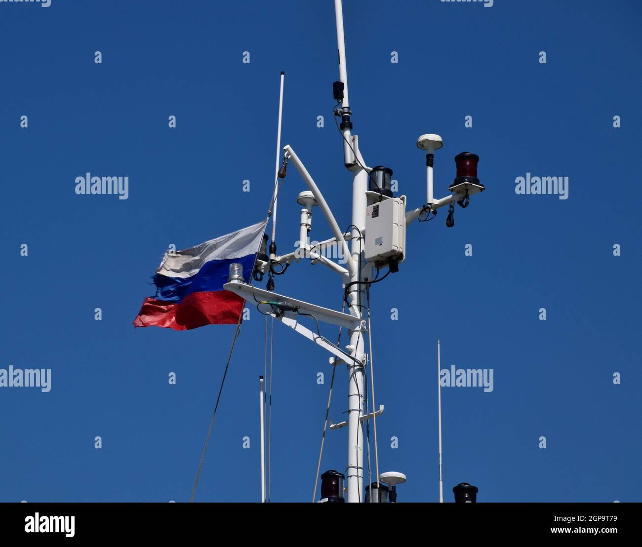 Mast of the port service ship. Devices of light signaling and ...