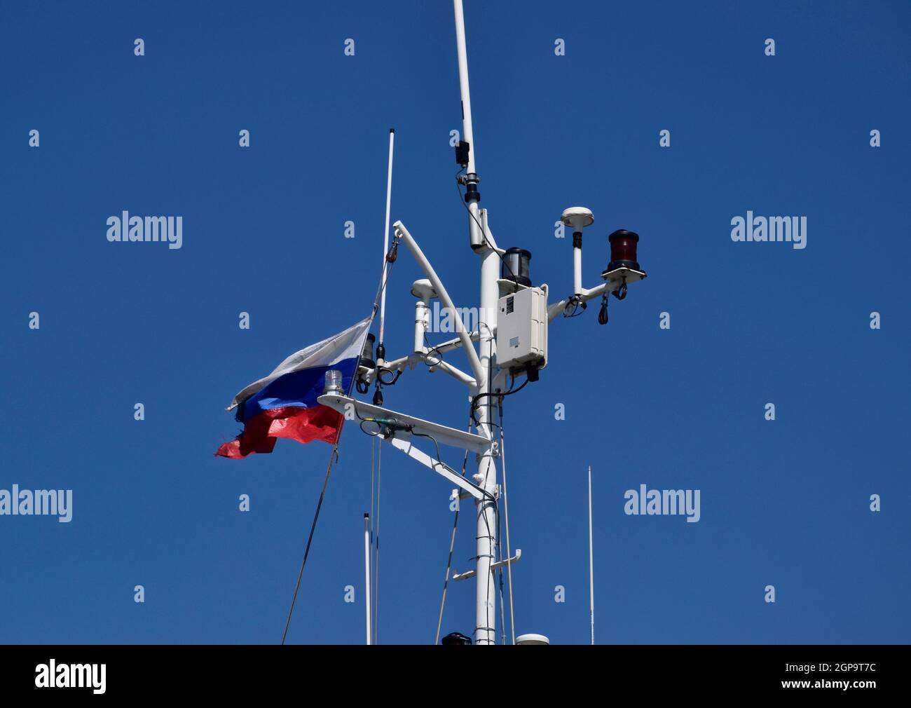 Mast of the port service ship. Devices of light signaling and ...