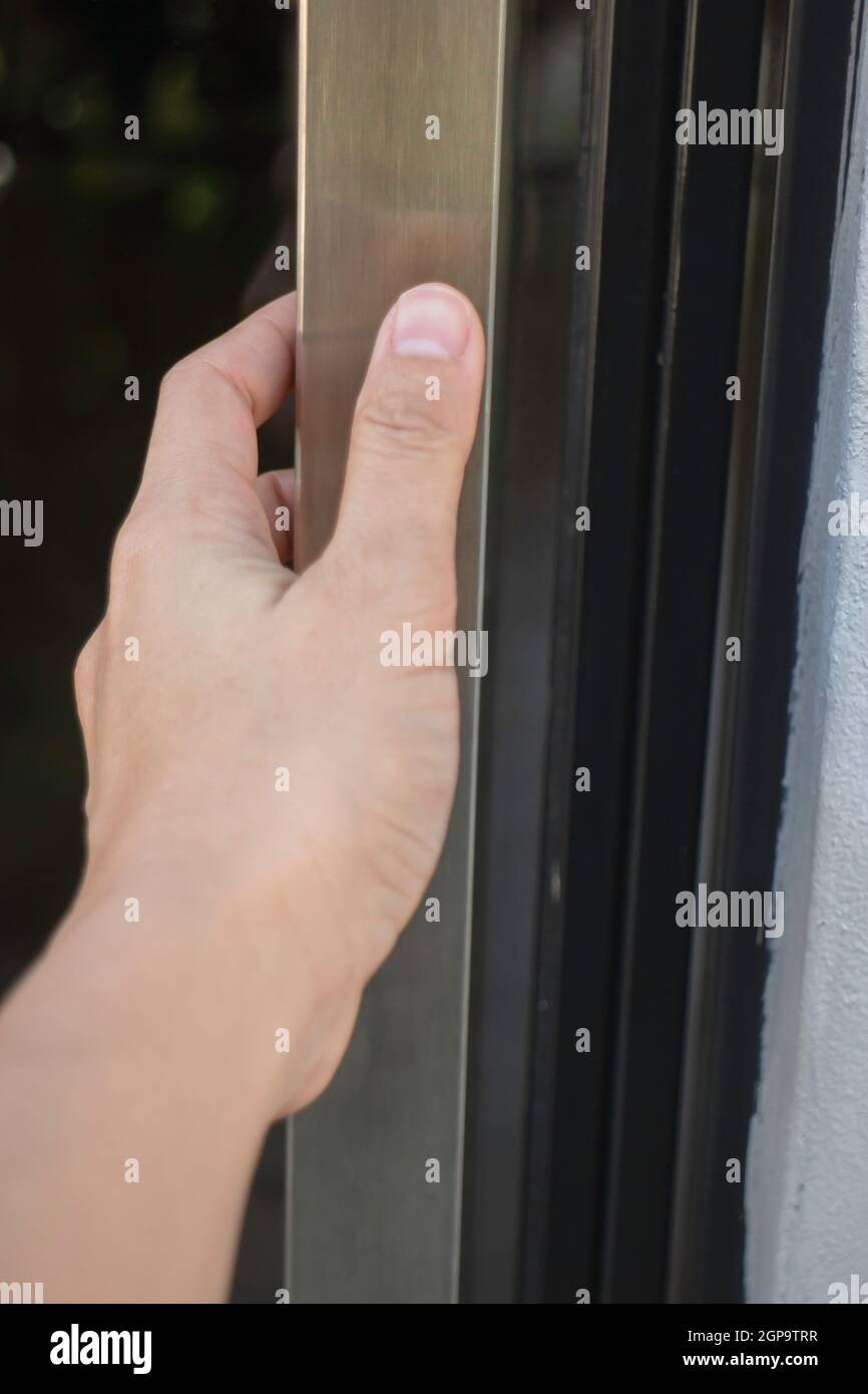 Hand on handle door for open to entering restaurant, stock photo Stock ...