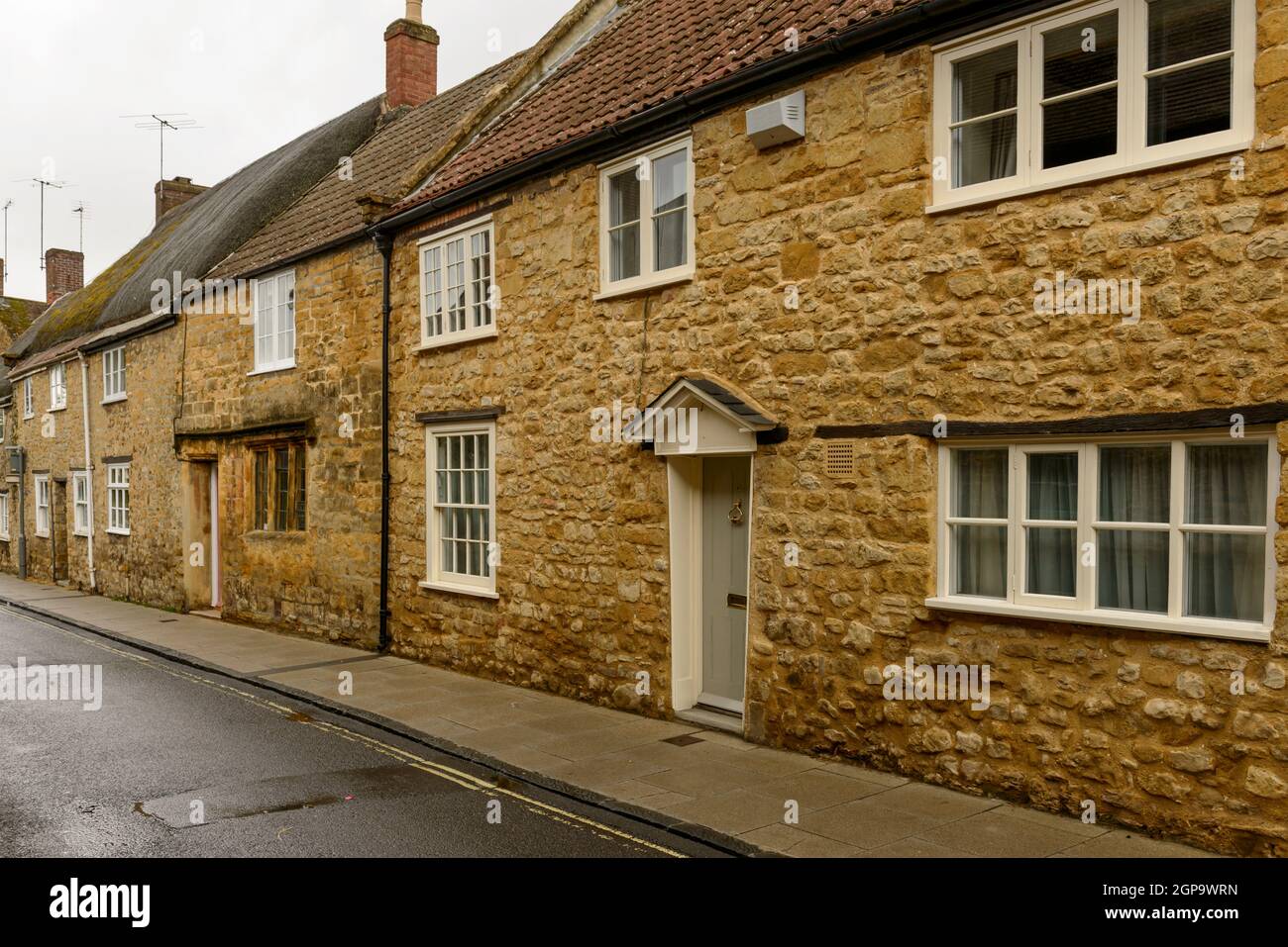 view of old houses and street in the historic village Stock Photo - Alamy
