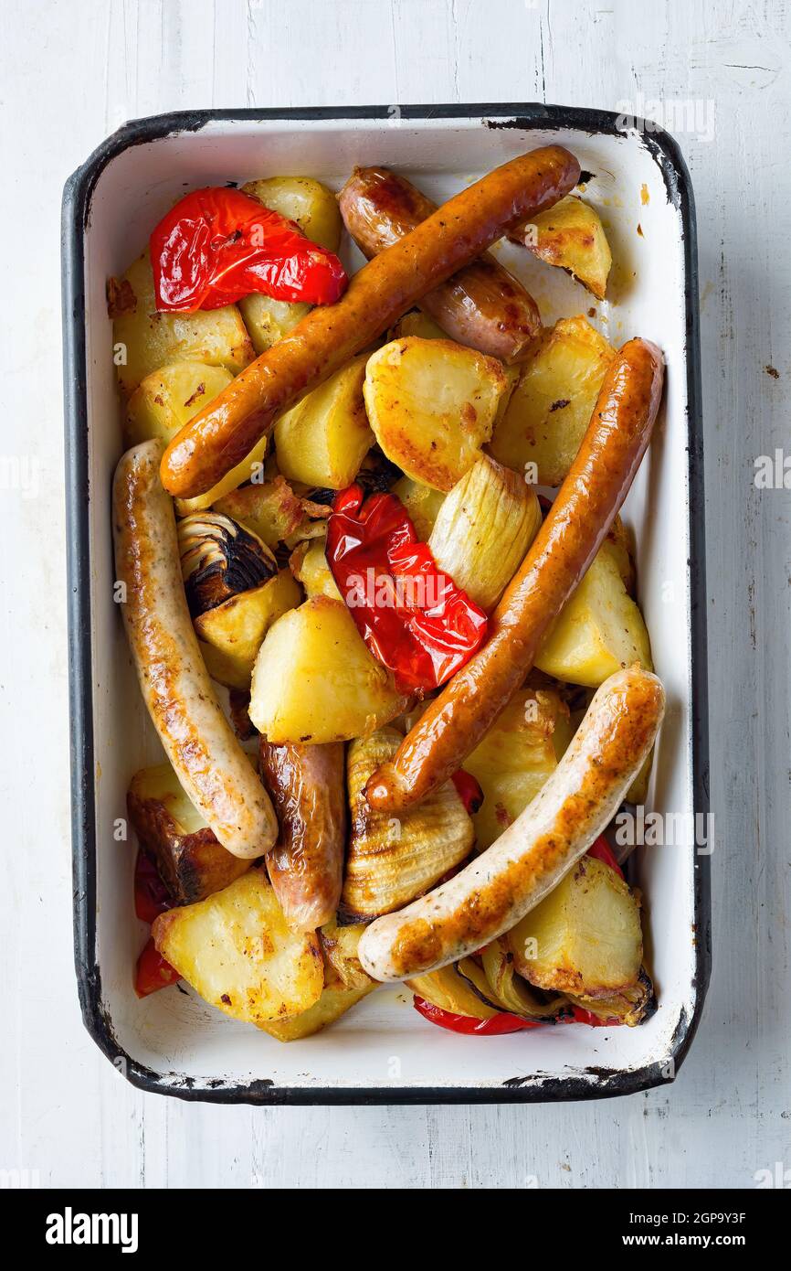 close up of tray of italian sausage golden potato bake Stock Photo - Alamy