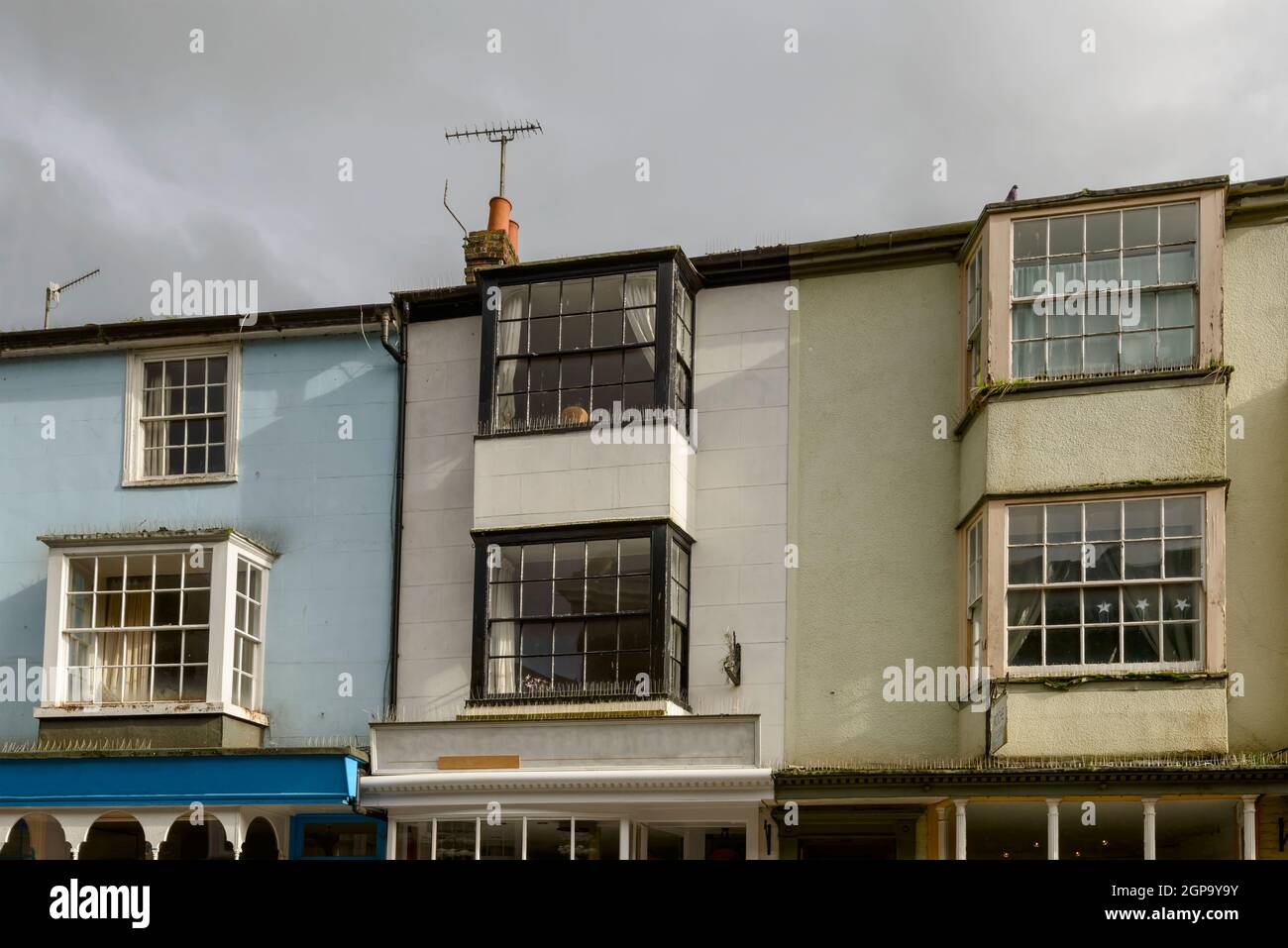 view of old bow windows on ancient houses in the historic village of ...