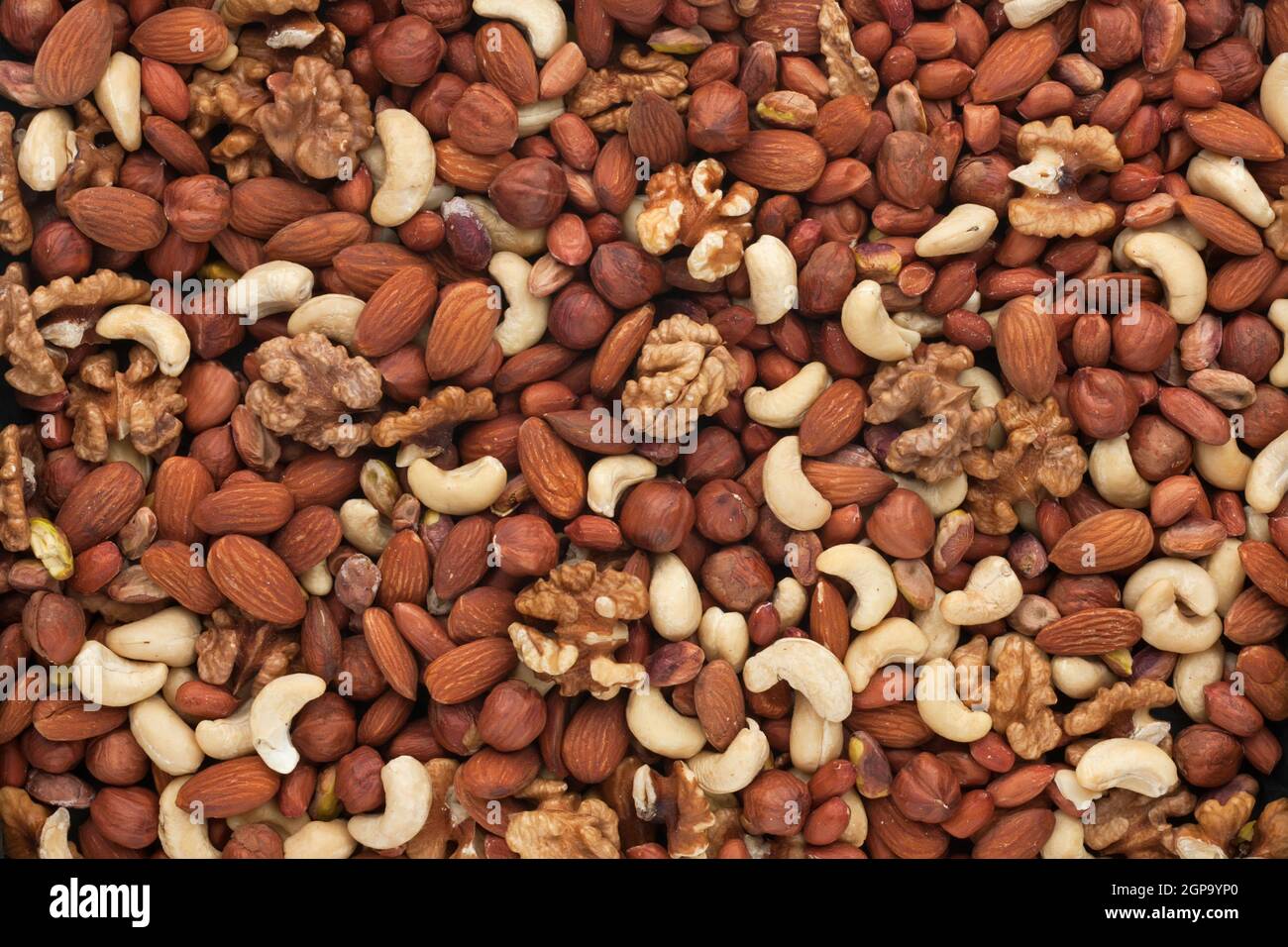 Mix of nuts can be used as background Stock Photo - Alamy