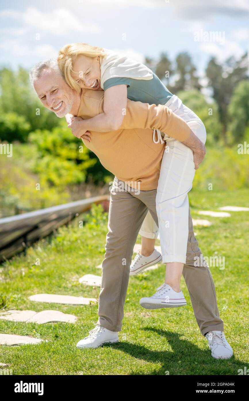 Married mature Caucasian couple having fun outdoors Stock Photo - Alamy