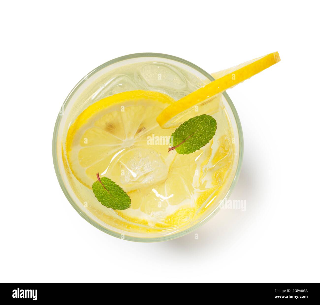 Lemonade in a glass placed on a white background. View from directly ...