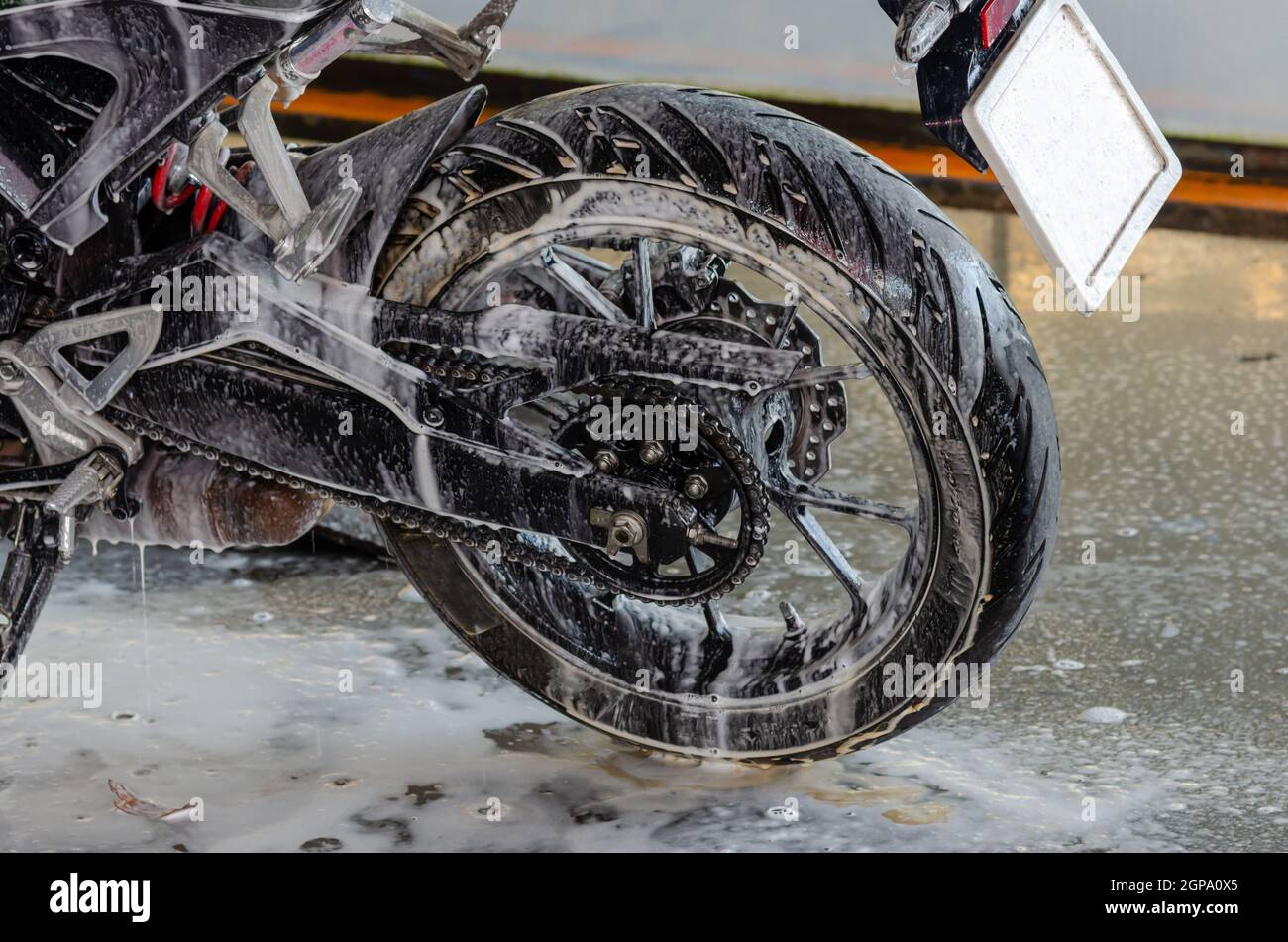 Clean up the motorcycle wash at the car wash shop Stock Photo - Alamy