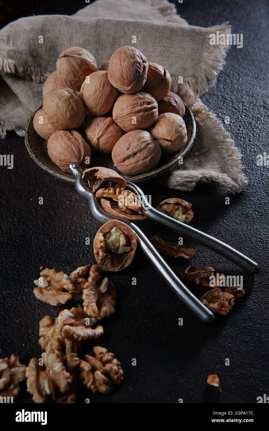 Cracking nuts dark hi-res stock photography and images - Alamy