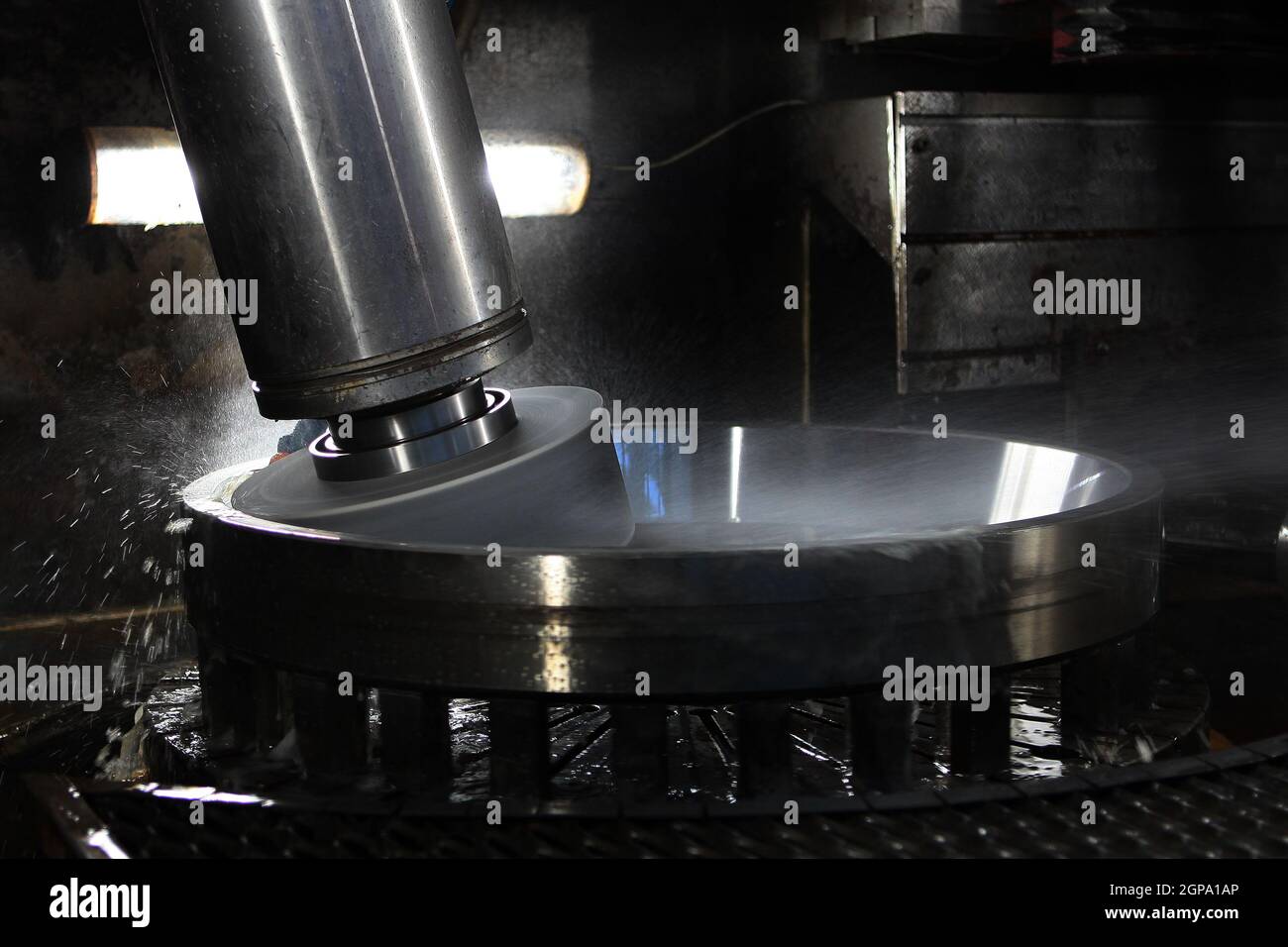 Bearing machining on the machine. Bearing processing machine. Splashes ...