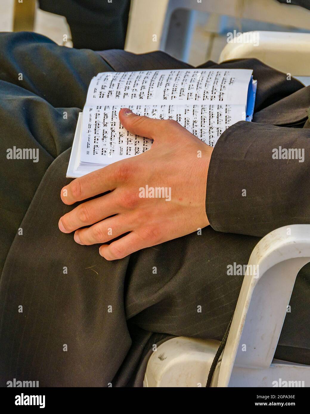 Detail view of man reading tora book at famous wailing wall, old ...