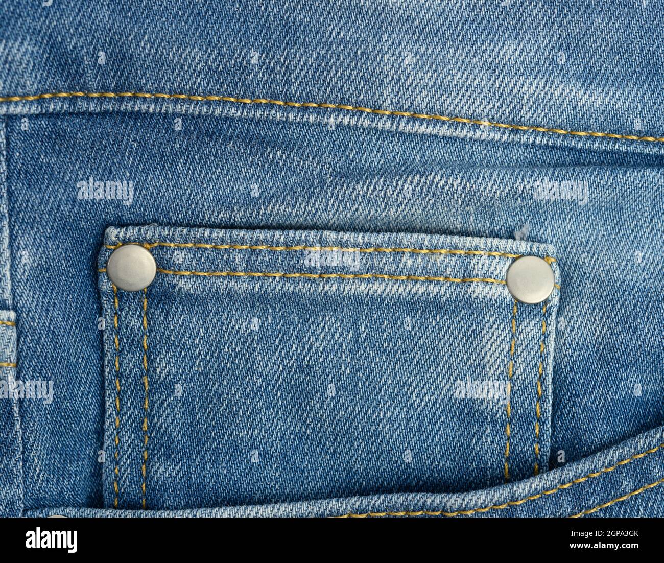 front pocket of blue classic jeans, full frame, close up Stock Photo ...