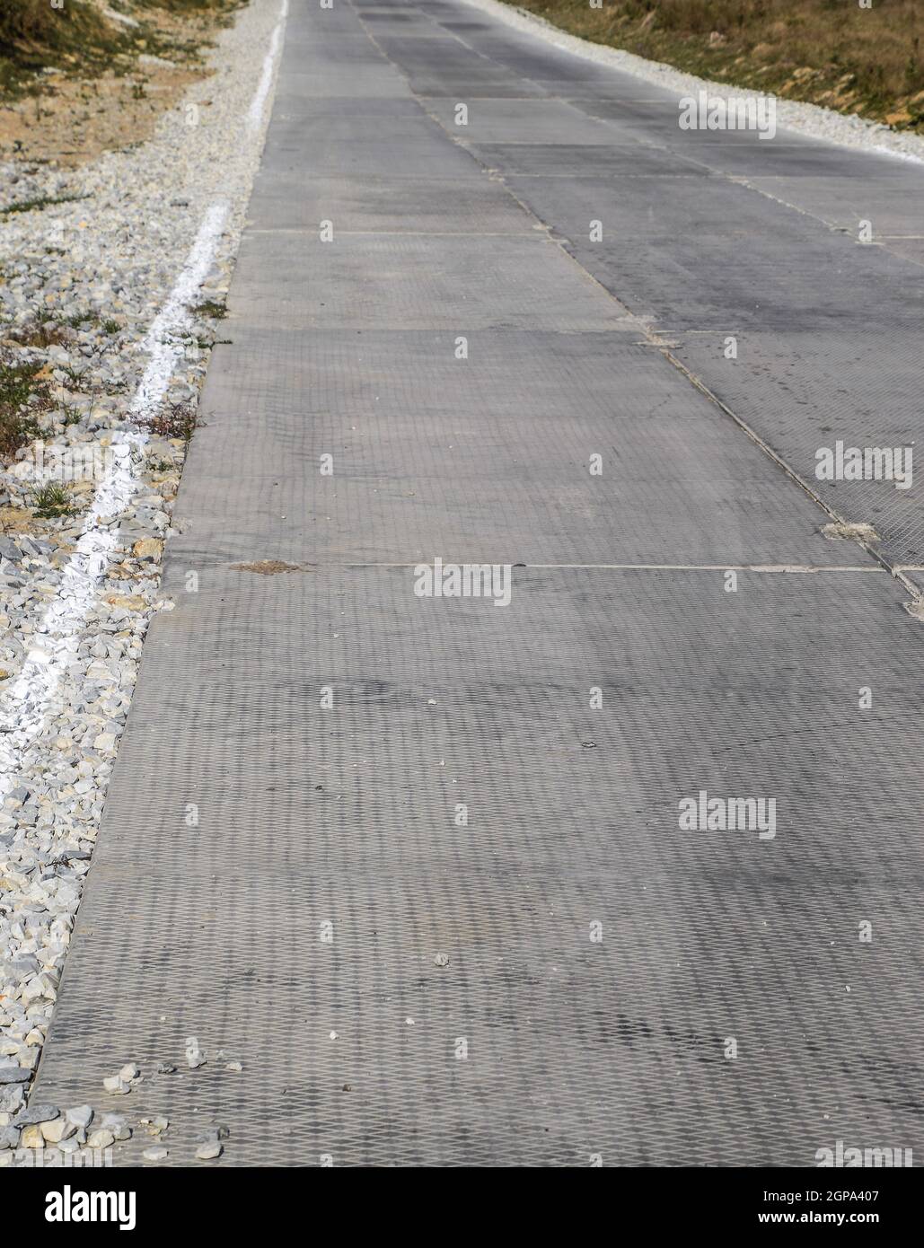 Road from concrete slabs. Reinforced concrete slabs on the road. Road ...