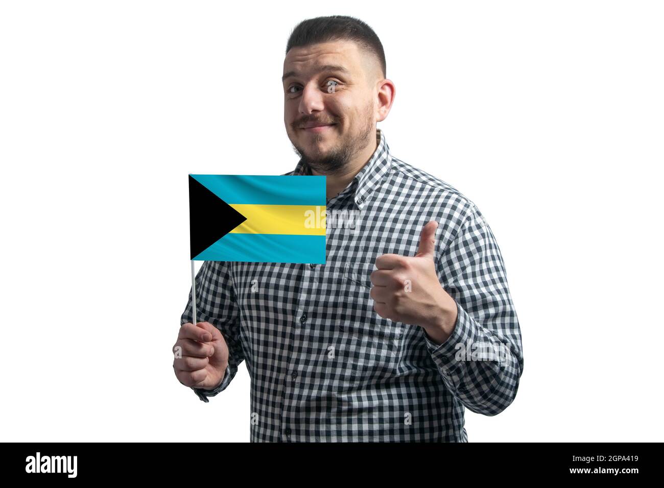 White guy holding a flag of Bahamas and shows the class by hand ...