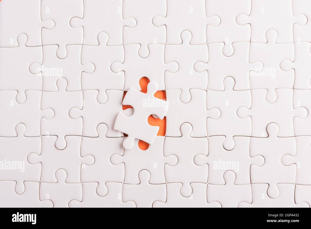 Top view flat lay of paper plain white jigsaw puzzle game texture ...