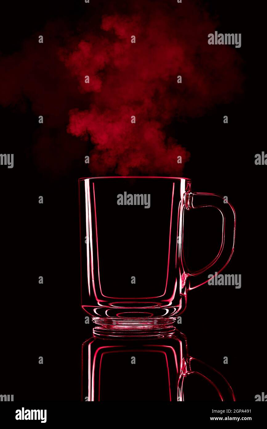 Just a glass on a black background with a reflection. Red color, with ...