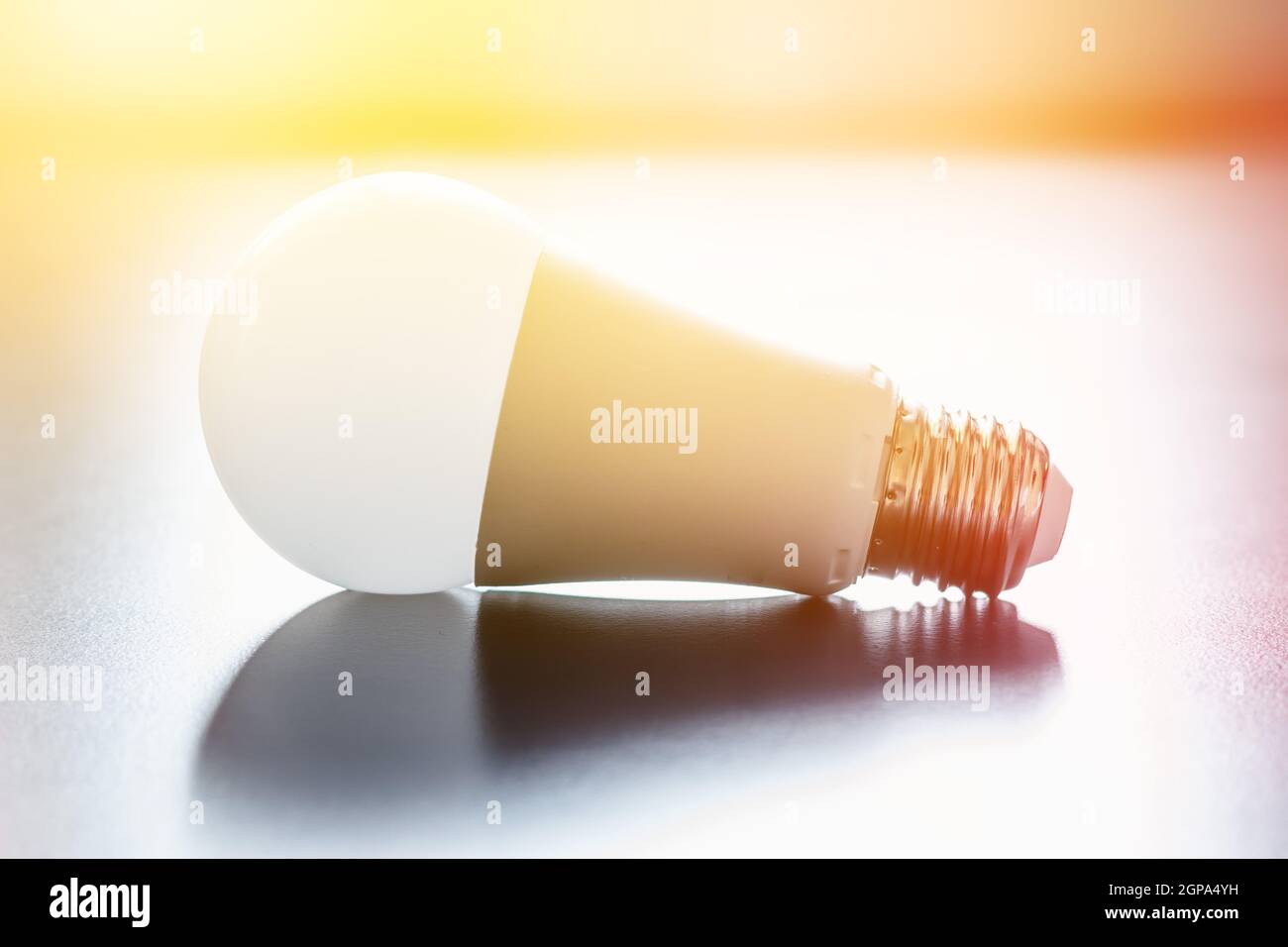 White light bulb lying on a desk, concept for ideas. Sunlight Stock ...