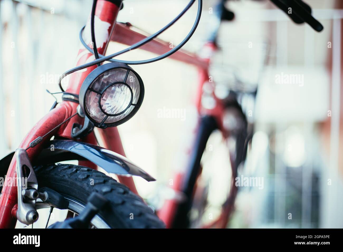 Front picture of a city bike, head lamp and blurry background Stock Photo - Alamy