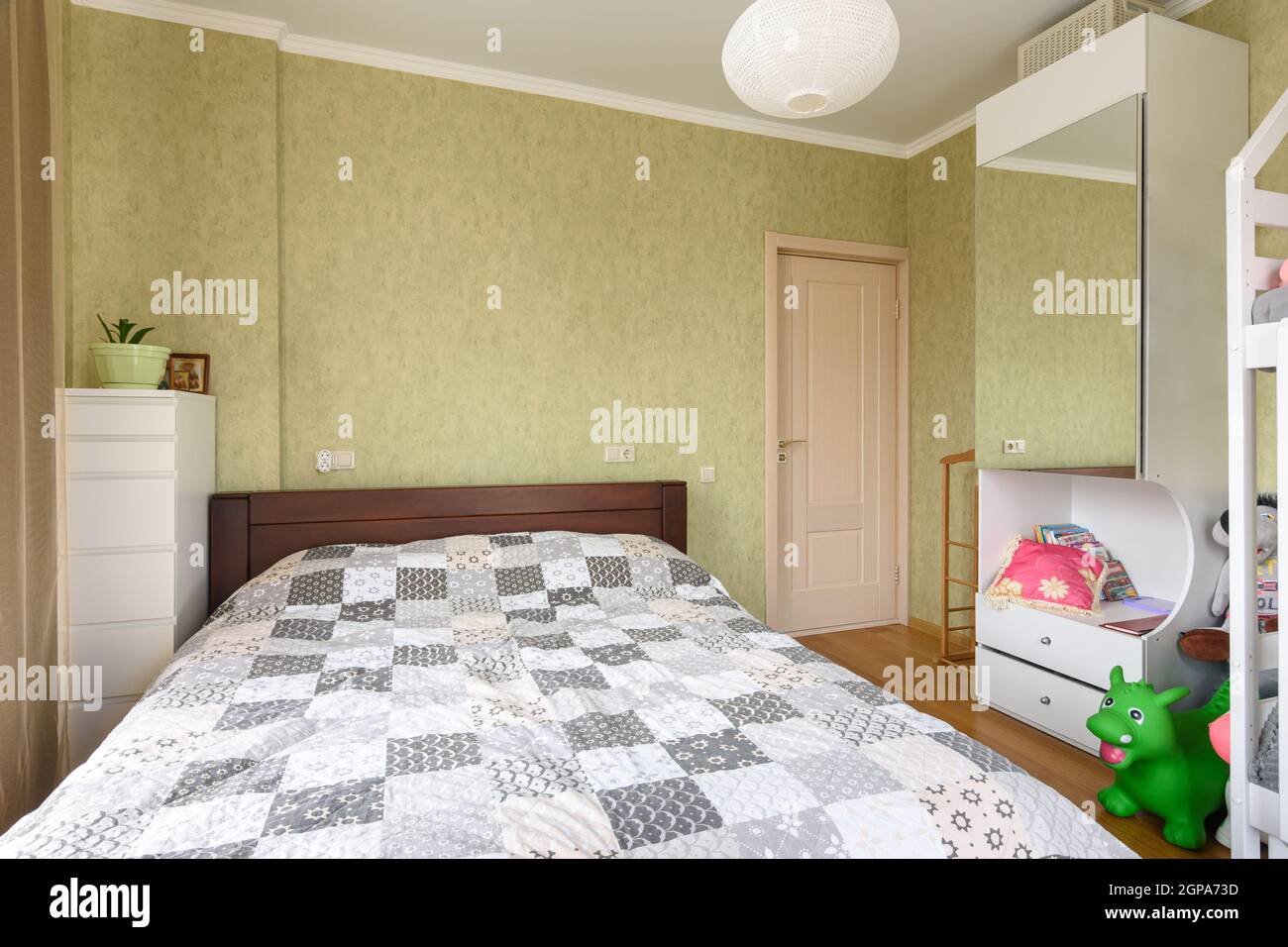 Bedroom interior with a large double bed Stock Photo - Alamy