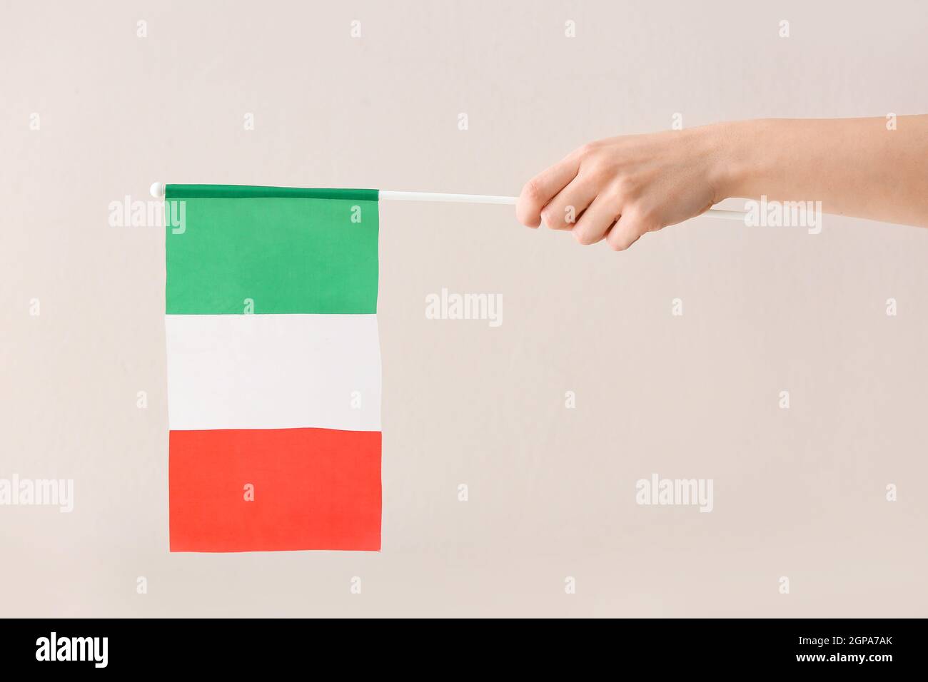 Female hand with national flag of Italy on light background Stock Photo ...