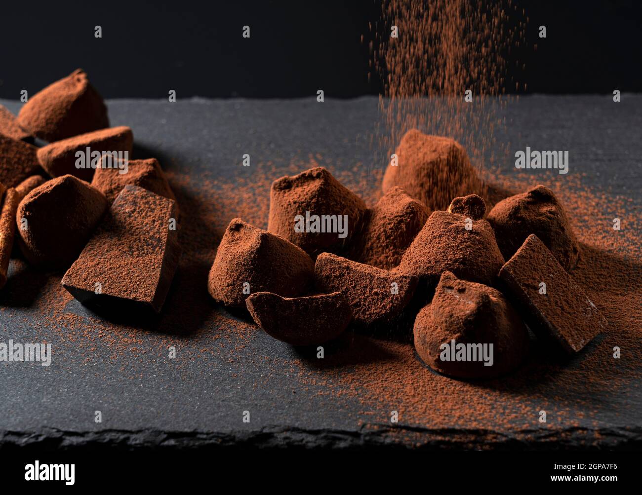 The moment you sprinkle cocoa powder on the truffle chocolate placed on ...