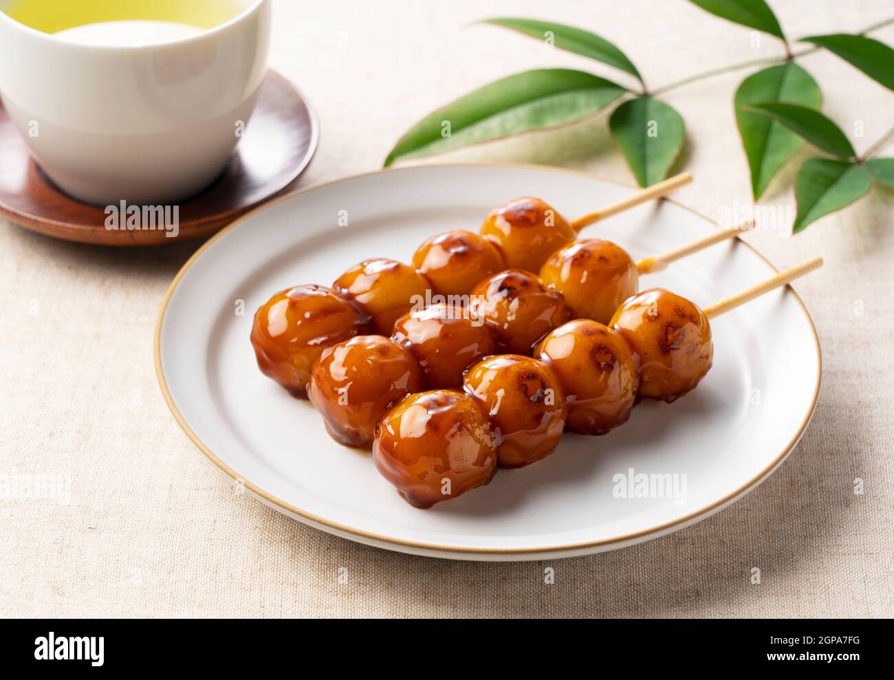 Mitarashi dango and green tea placed on a cloth. Image of a Japanese ...