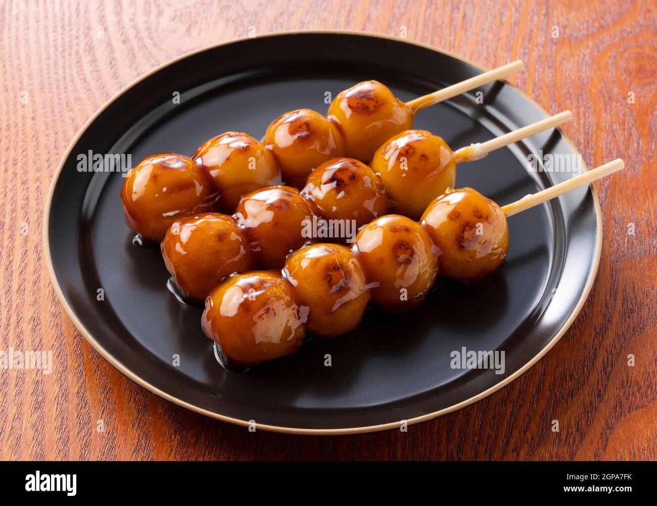 Mitarashi dango placed on a wooden background. Image of mitarashi dango ...