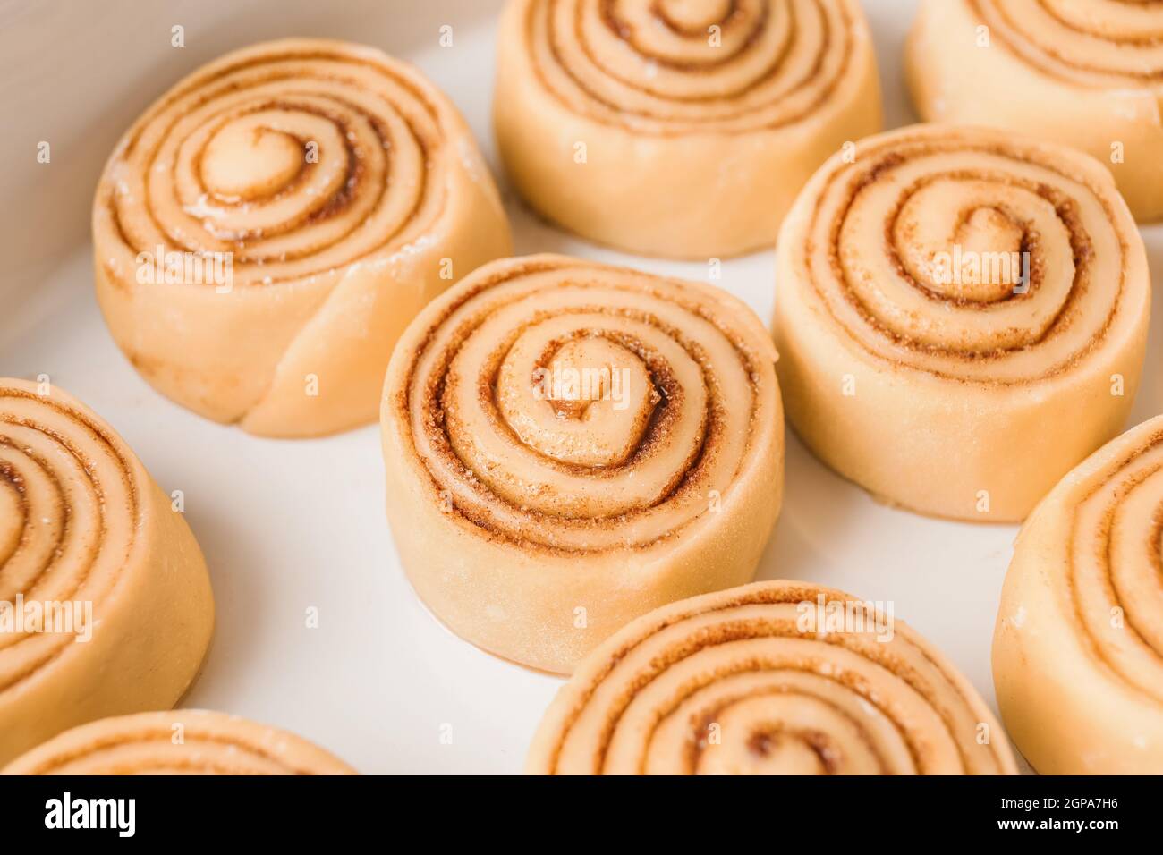 Baking dish with uncooked cinnamon rolls, closeup Stock Photo - Alamy