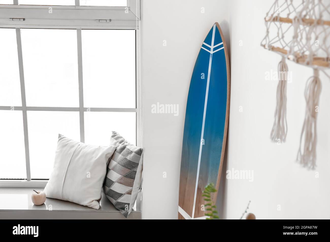 Interior of stylish room with surfboard Stock Photo - Alamy