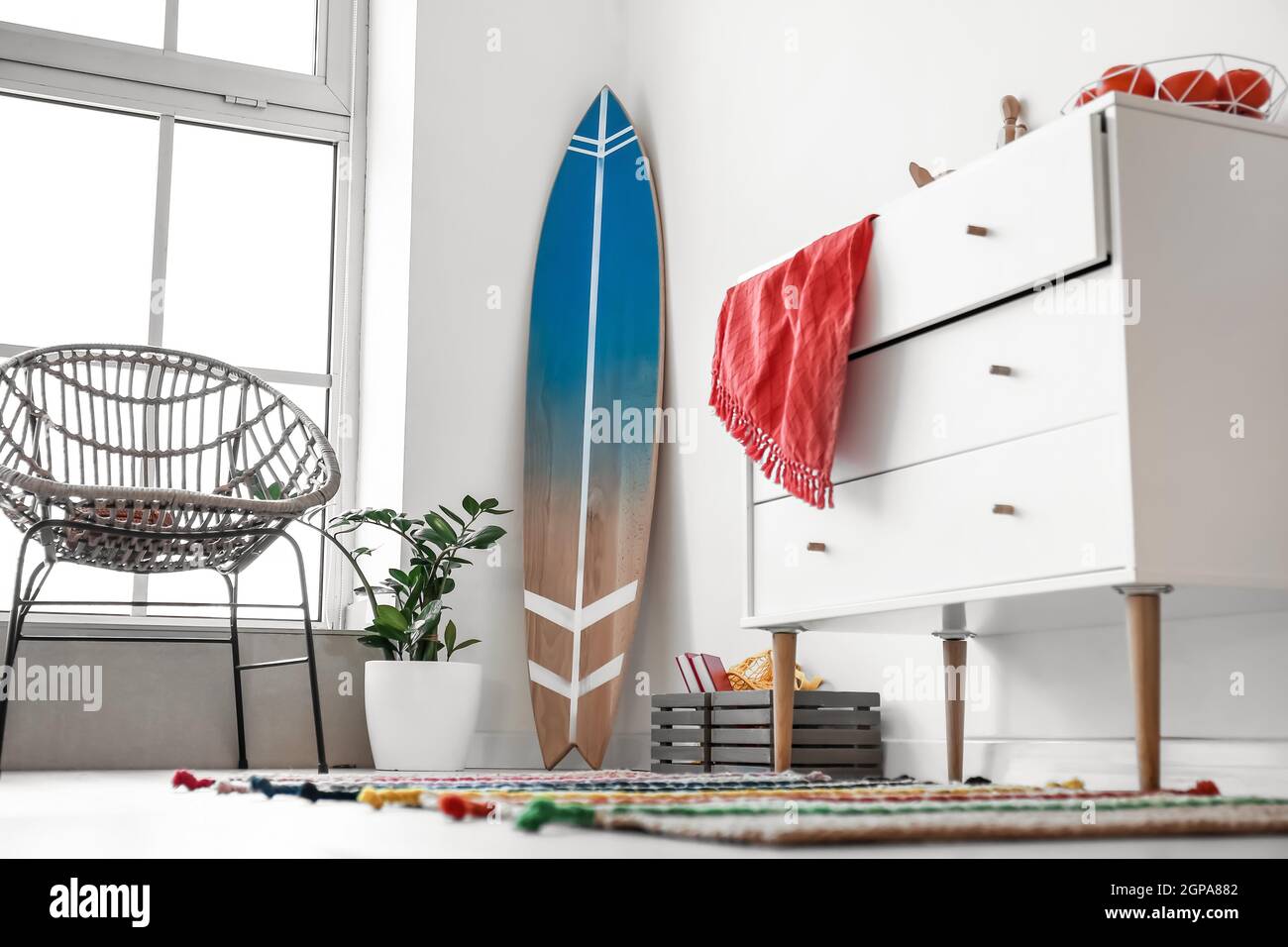 Interior of stylish room with surfboard Stock Photo - Alamy