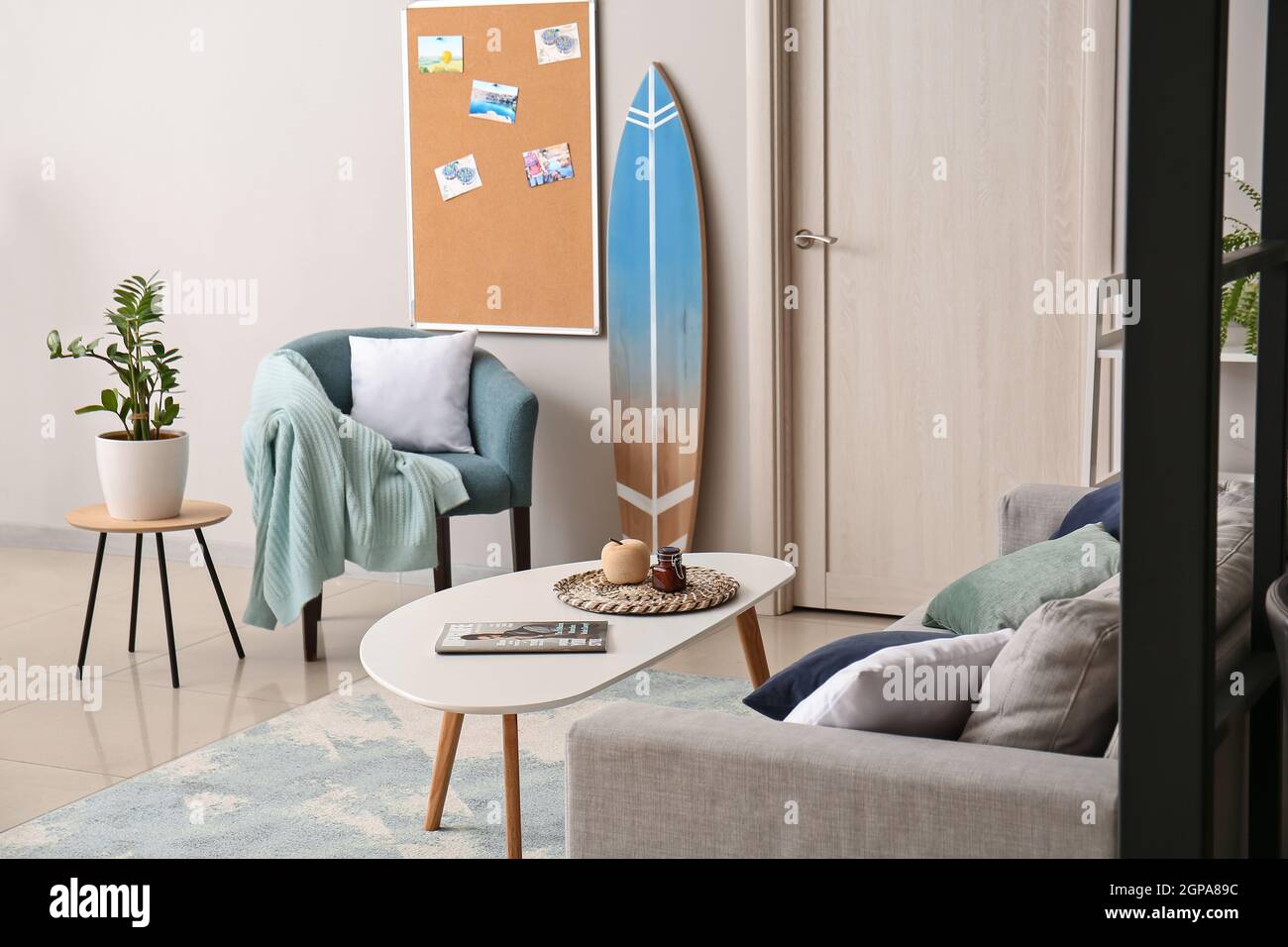 Interior of stylish room with surfboard Stock Photo - Alamy