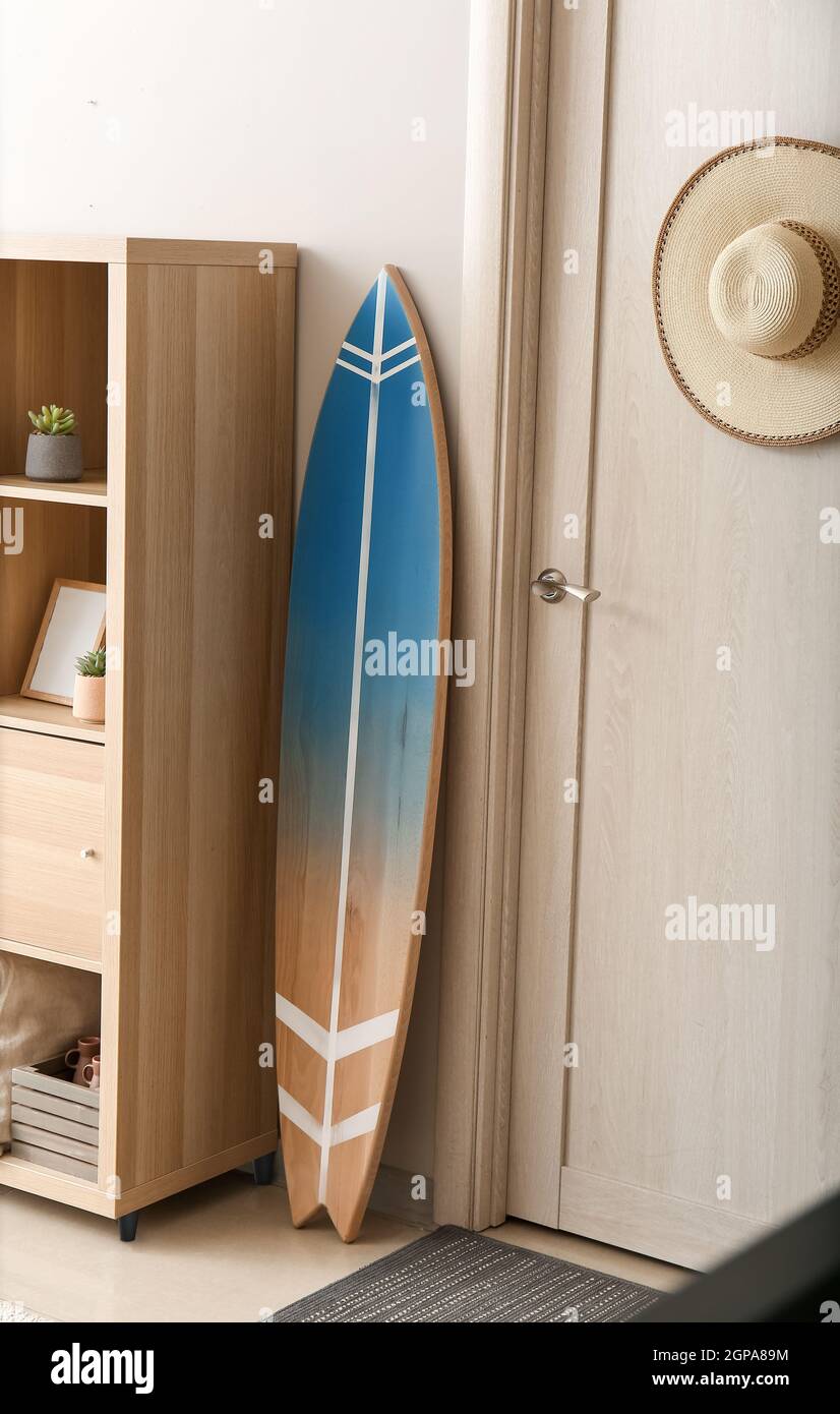 Interior of modern stylish hall with surfboard Stock Photo - Alamy