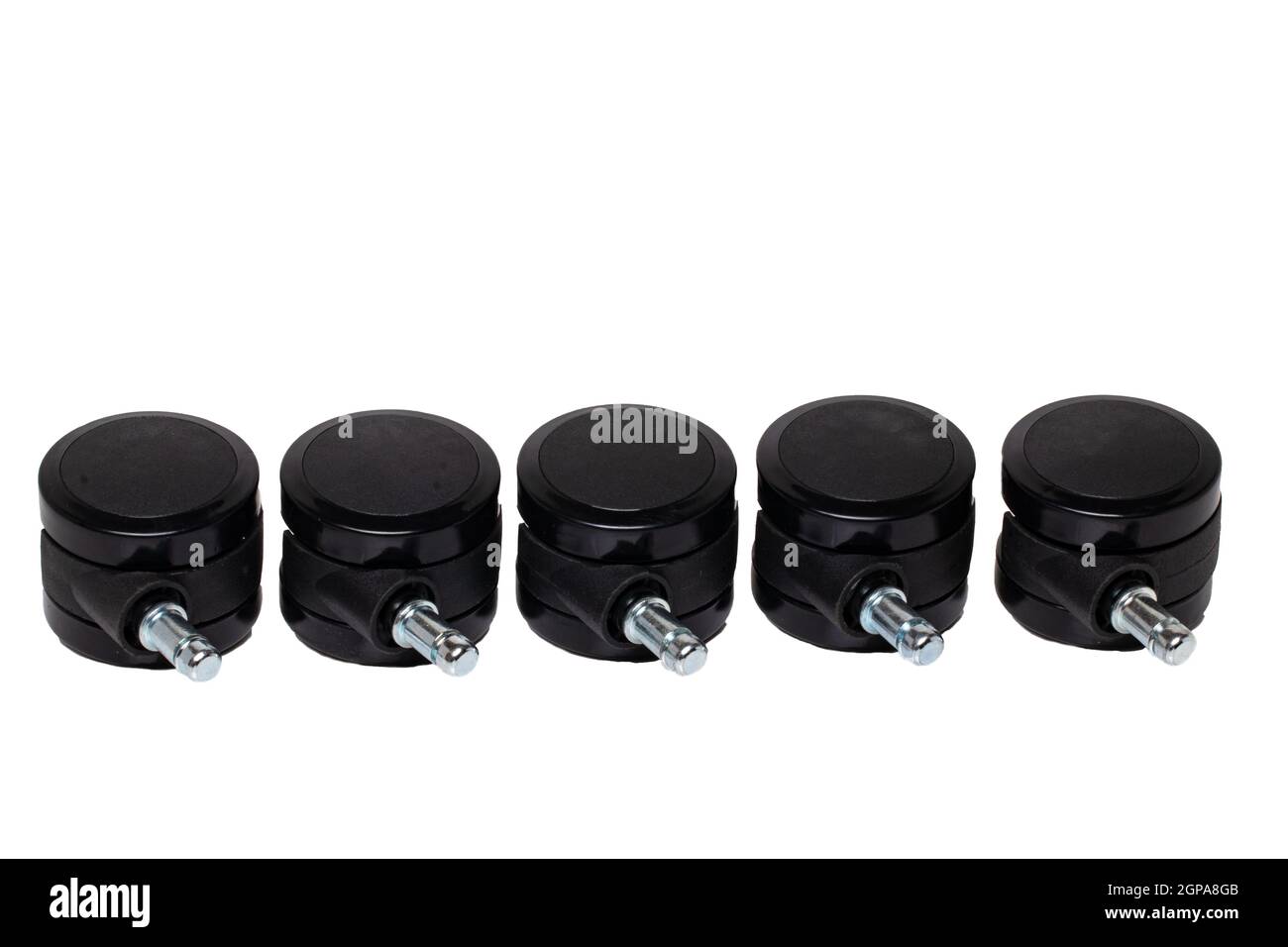 Spare parts isolated. Closeup of five black plastic wheels for a office ...