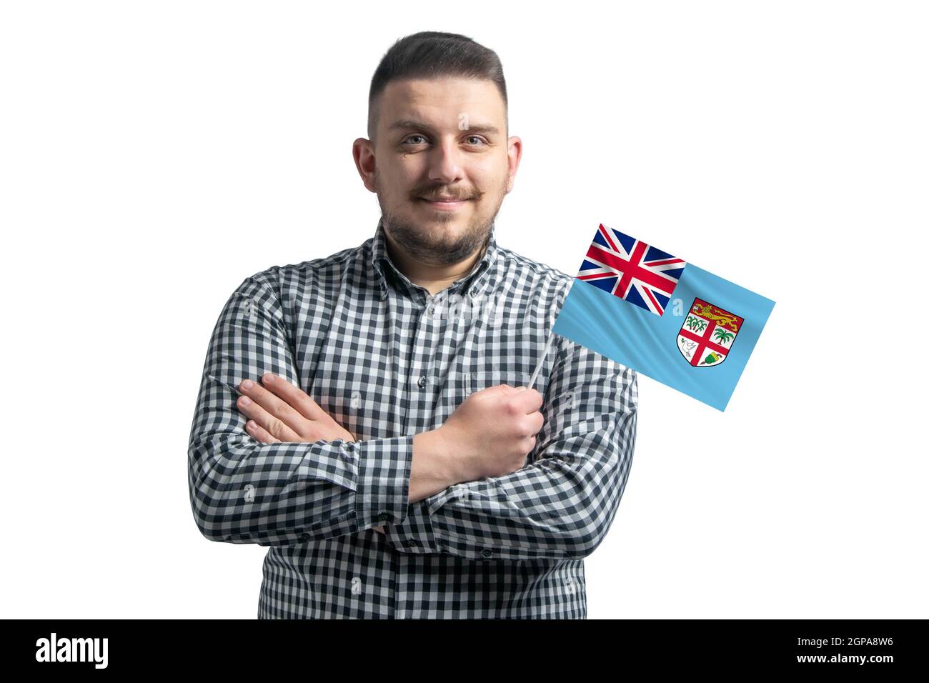 White guy holding a flag of Fiji smiling confident with crossed arms ...