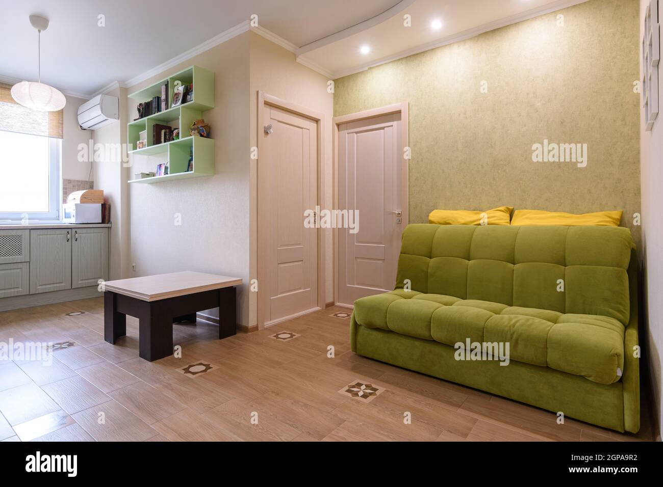 Interior of a living room combined with a kitchen in a two-room ...