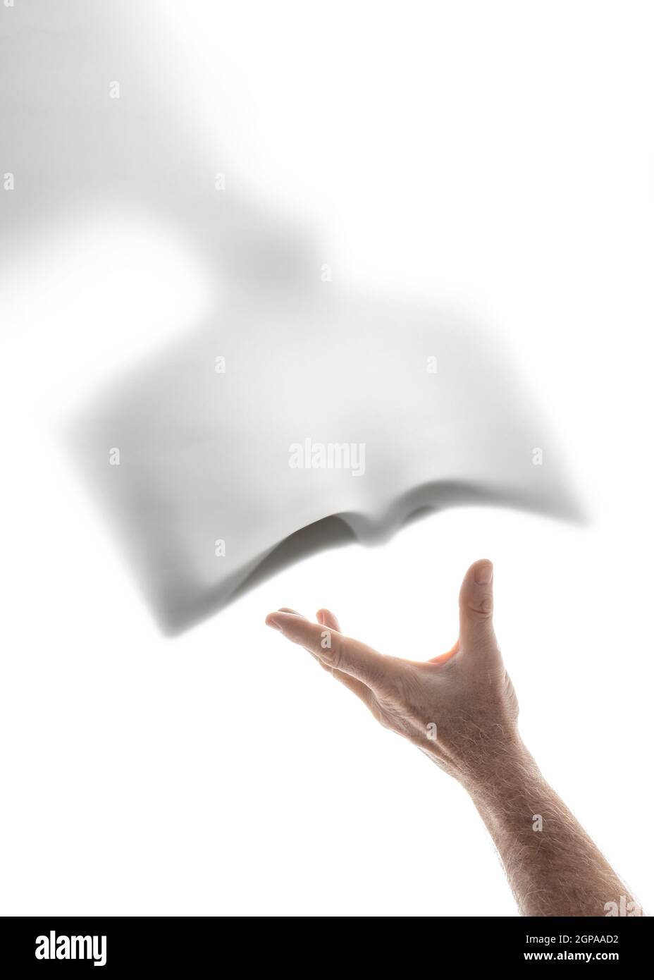 Human hand receiving the word of God brought by a heavenly messenger ...