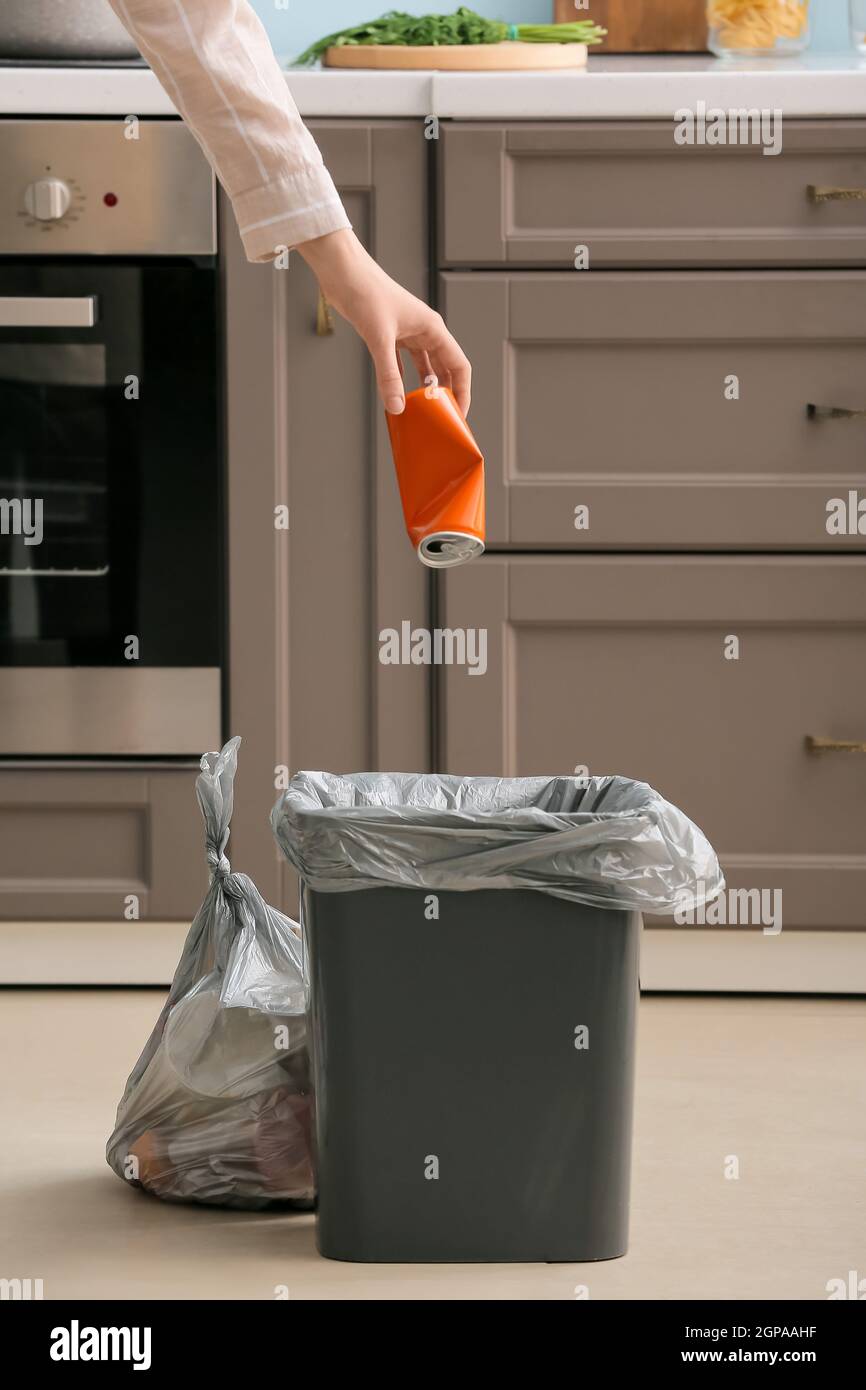 Young woman sorting garbage in hi-res stock photography and images - Alamy